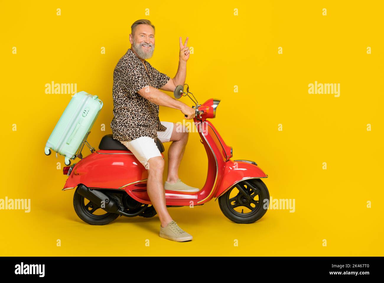 Full body profile photo of funky man drive bike demonstrate v-sign ...