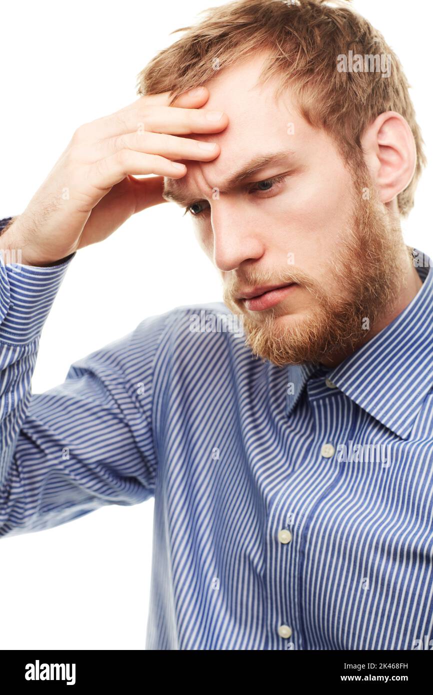 I cant take this anymore. A worried looking young man rubbing his ...