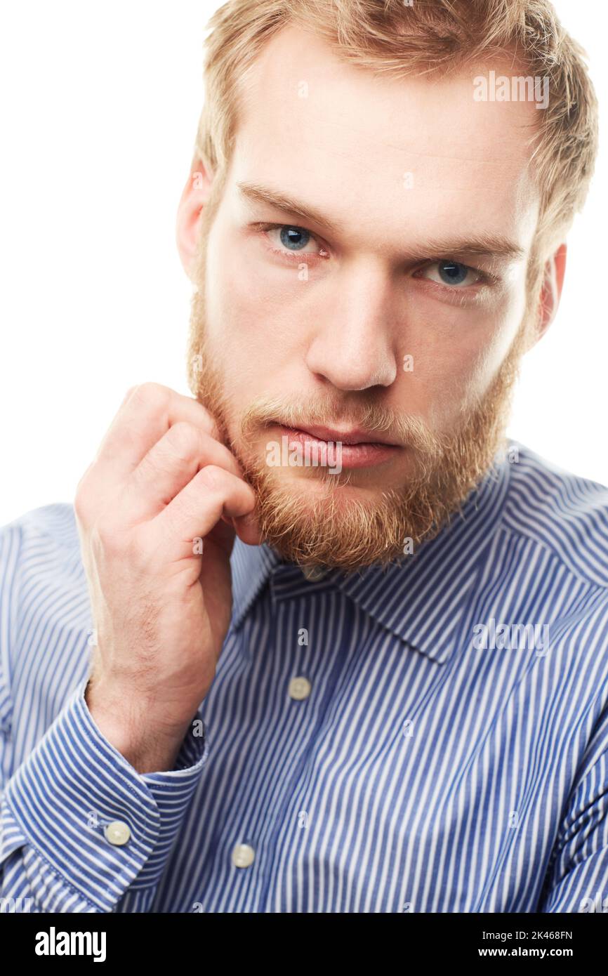 Putting on a brave face. Portrait of an unshaven young man touching his ...