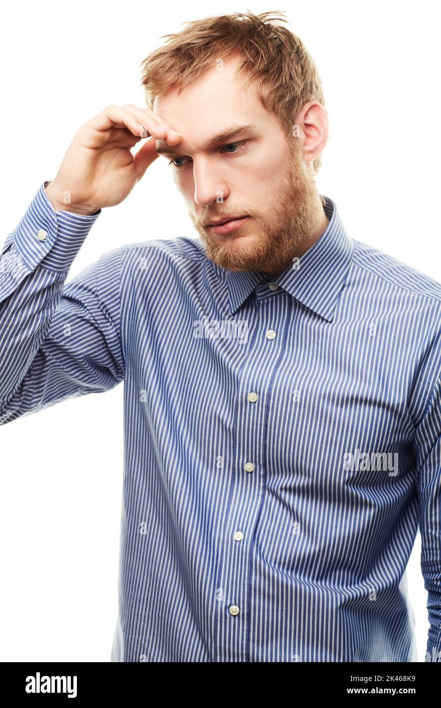 Searching for solutions. A worried looking young man touching his ...