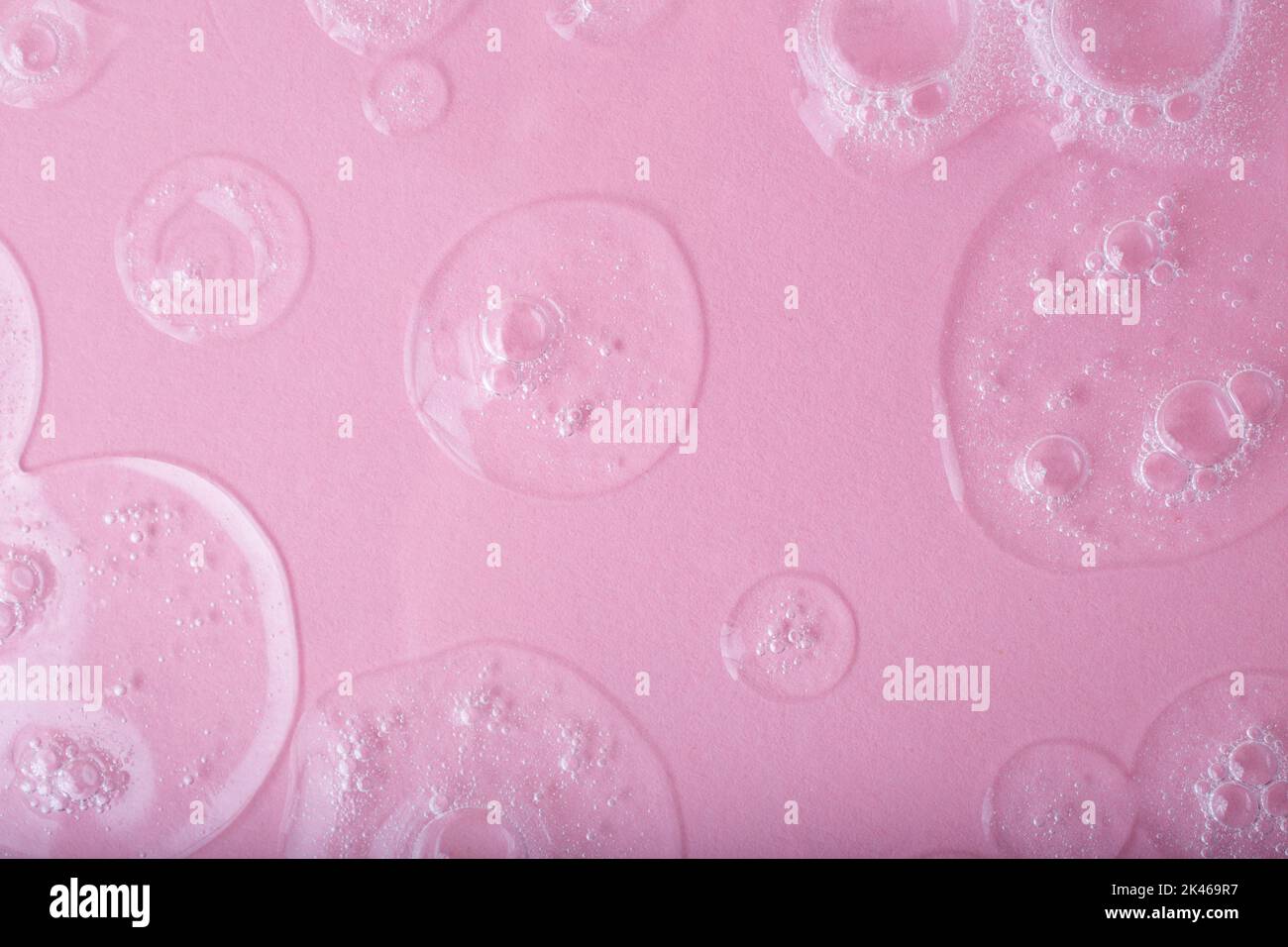 Macro photography of bubbly smear on raspberry pink background Stock ...