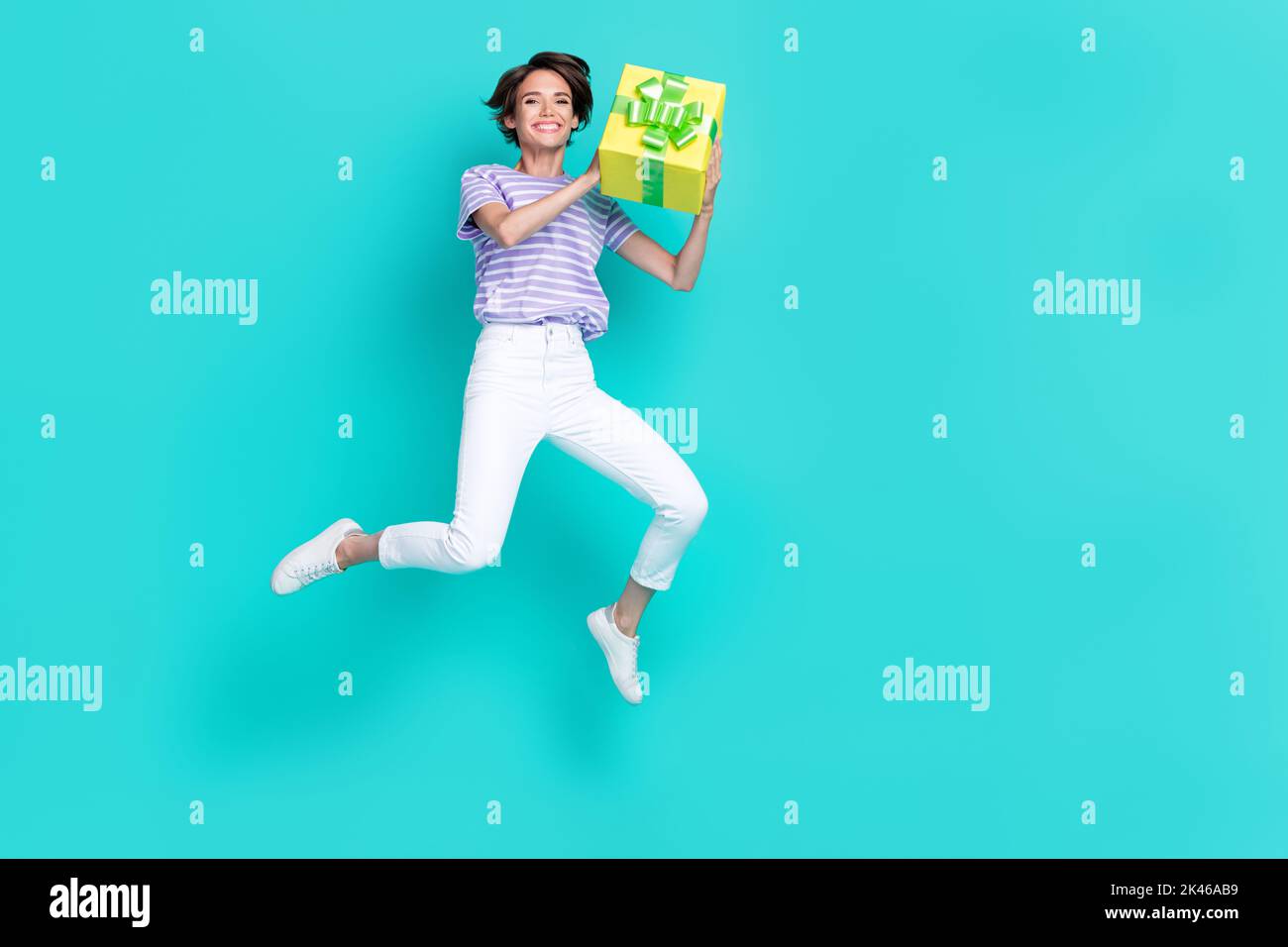Full length photo of adorable funny girl dressed purple t-shirt jumping ...