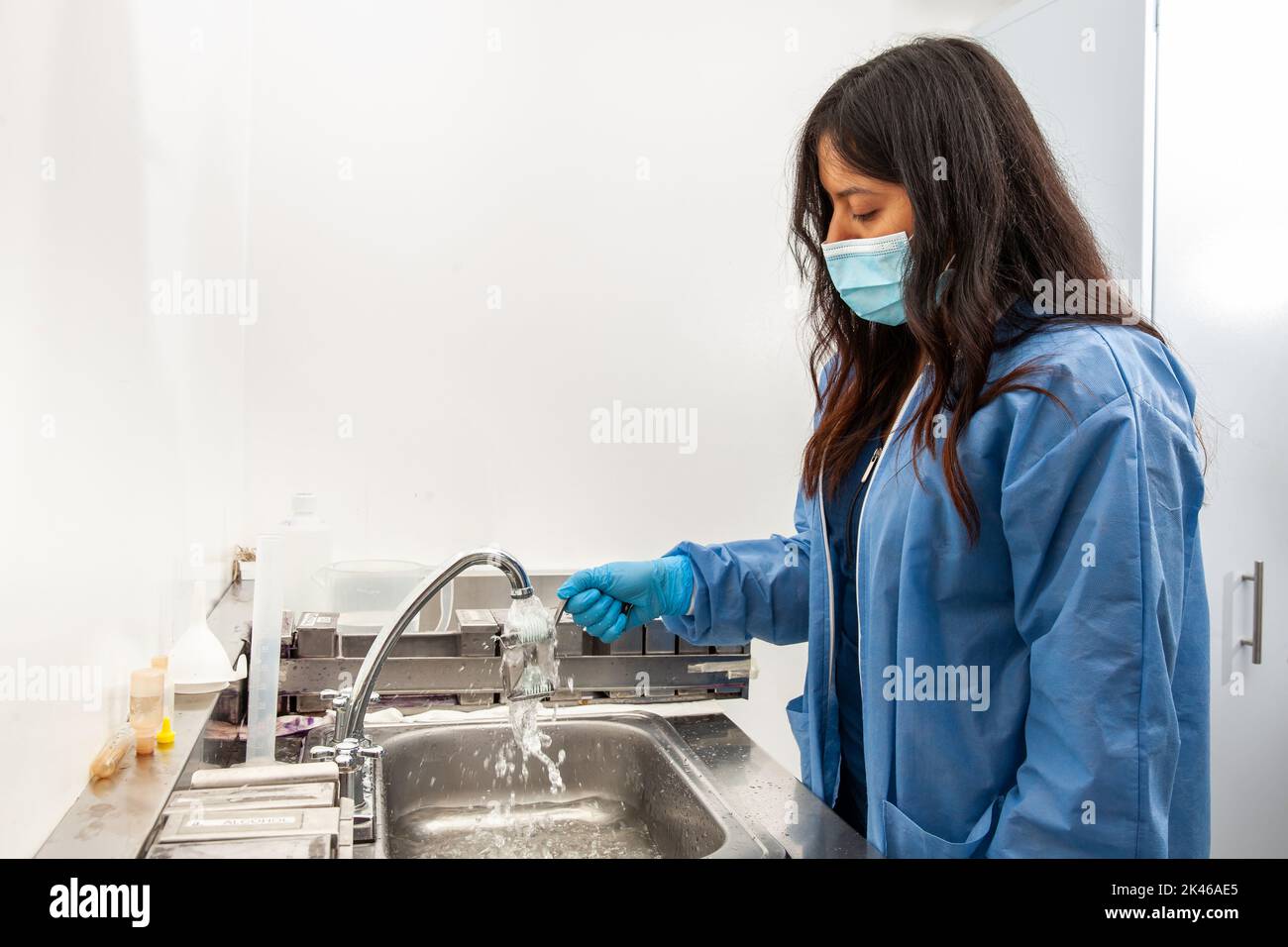 Young female scientist dewaxing paraffin embedded tissue samples in the ... Young female scientist dewaxing paraffin embedded tissue samples in the ...