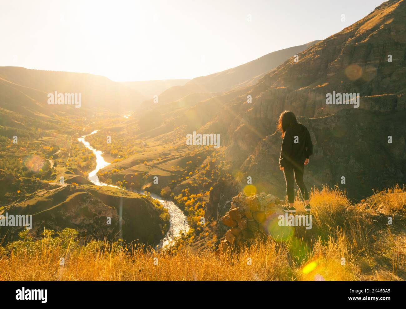 Solo woman tourist admire stand on rocky cliff with dramatic stunning ...