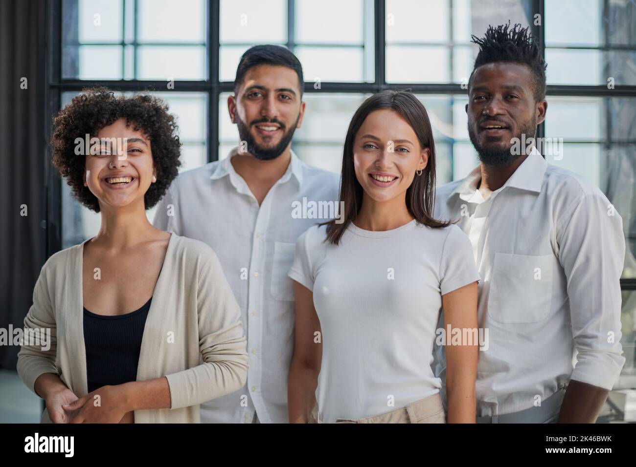 Smiling professional business leaders and employees group team portrait ...