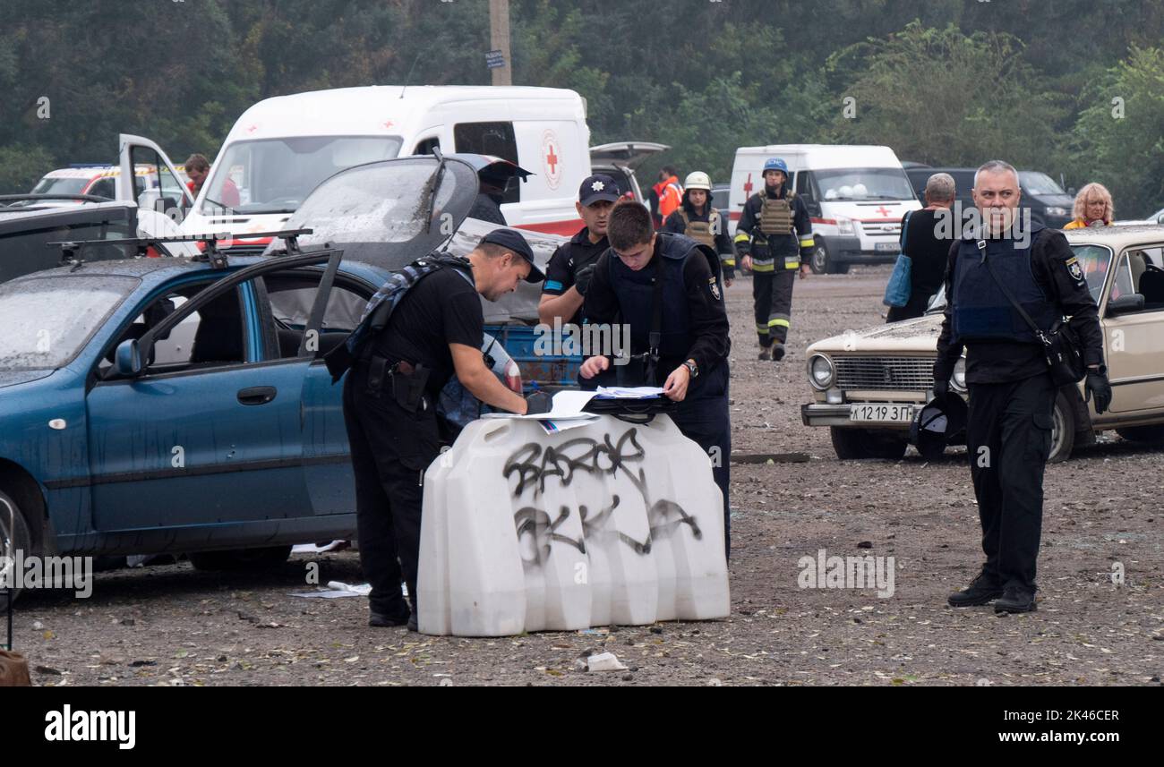 Police investigate a Russian missile strike on a civilian convoy Stock ...