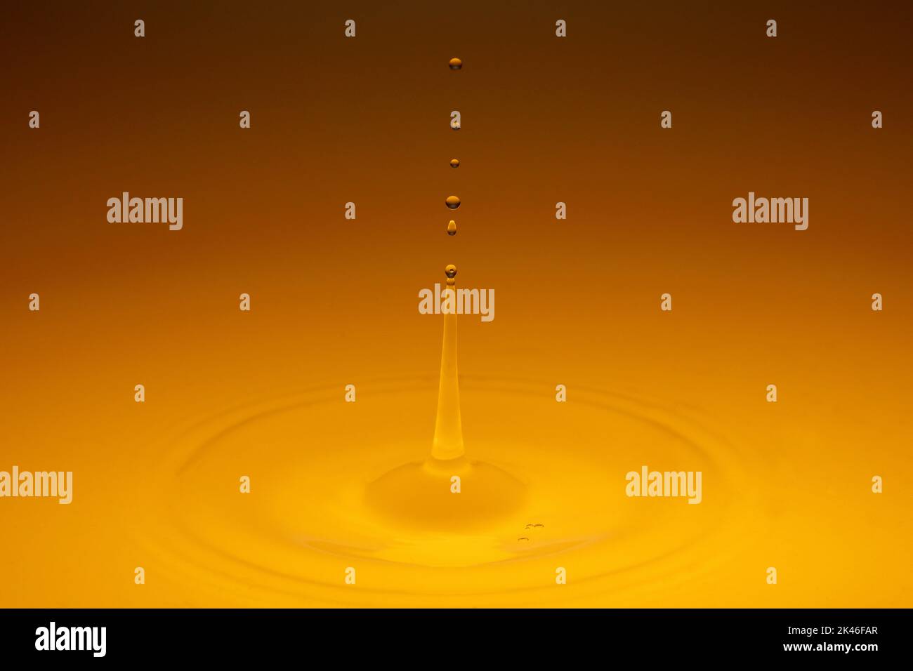 A rising column after the impact of a water drop Stock Photo - Alamy