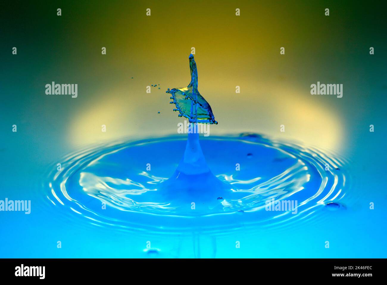 An ascending water column with a little splashing umbrella Stock Photo ...