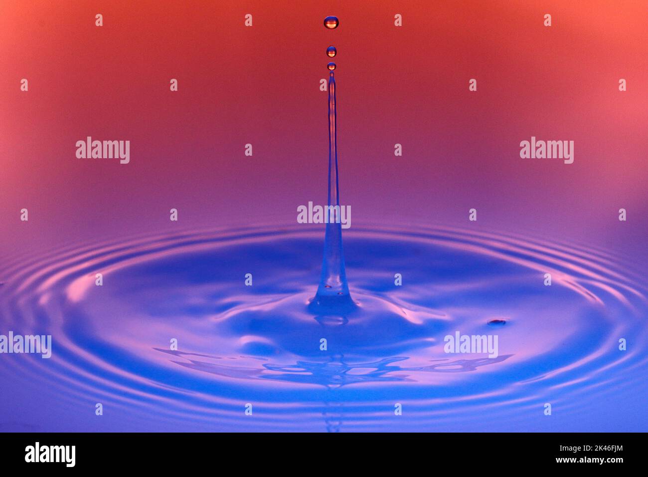 A rising column after the impact of a water drop Stock Photo - Alamy