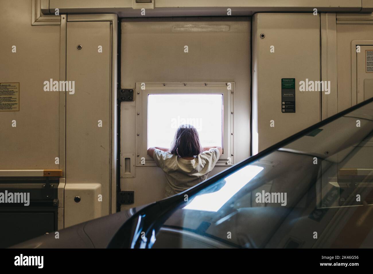 Small child looks out of Eurotunnel window Stock Photo - Alamy