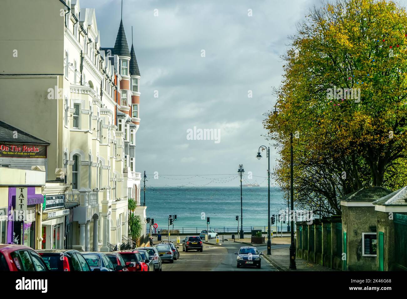 Street of Douglas city in Isle of Man with Douglas Bay in background ...