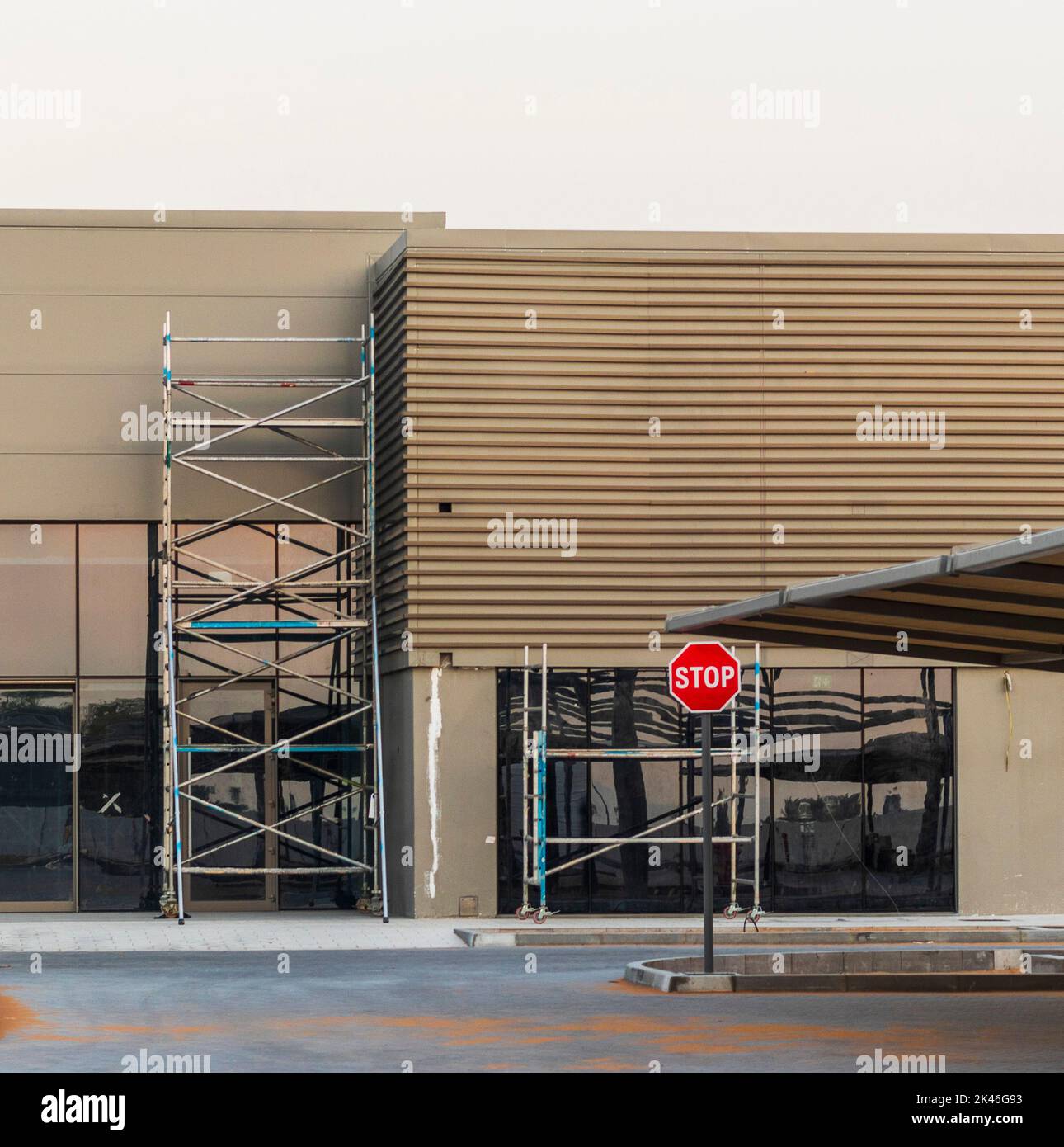 Shot of a empty parking and building under final stages of construction ...