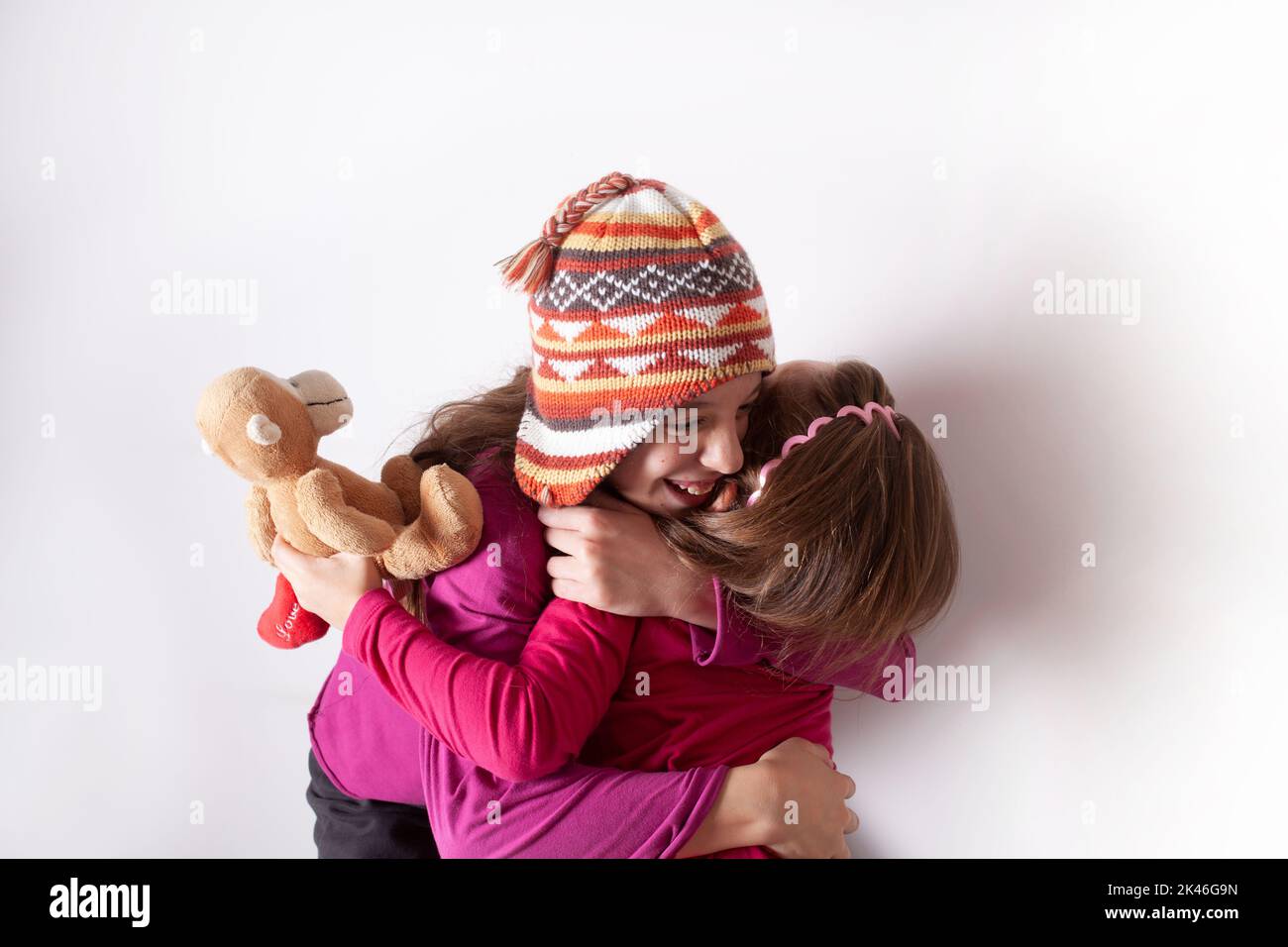 Happy and healthy young little girls hugging and smiling. Best friend ...