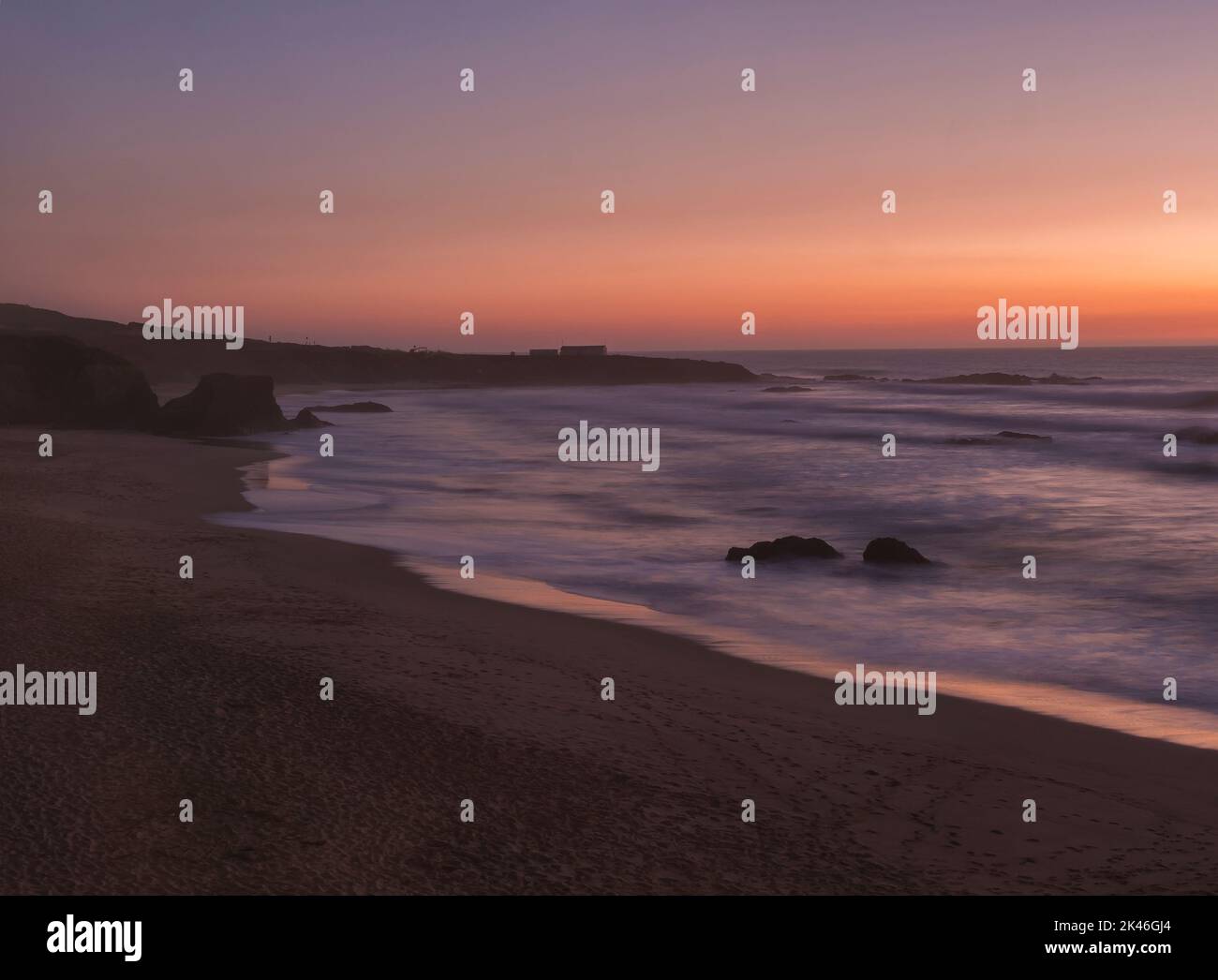 Mysterious long exposure view of sand beach Praia Grande de Almograve ...