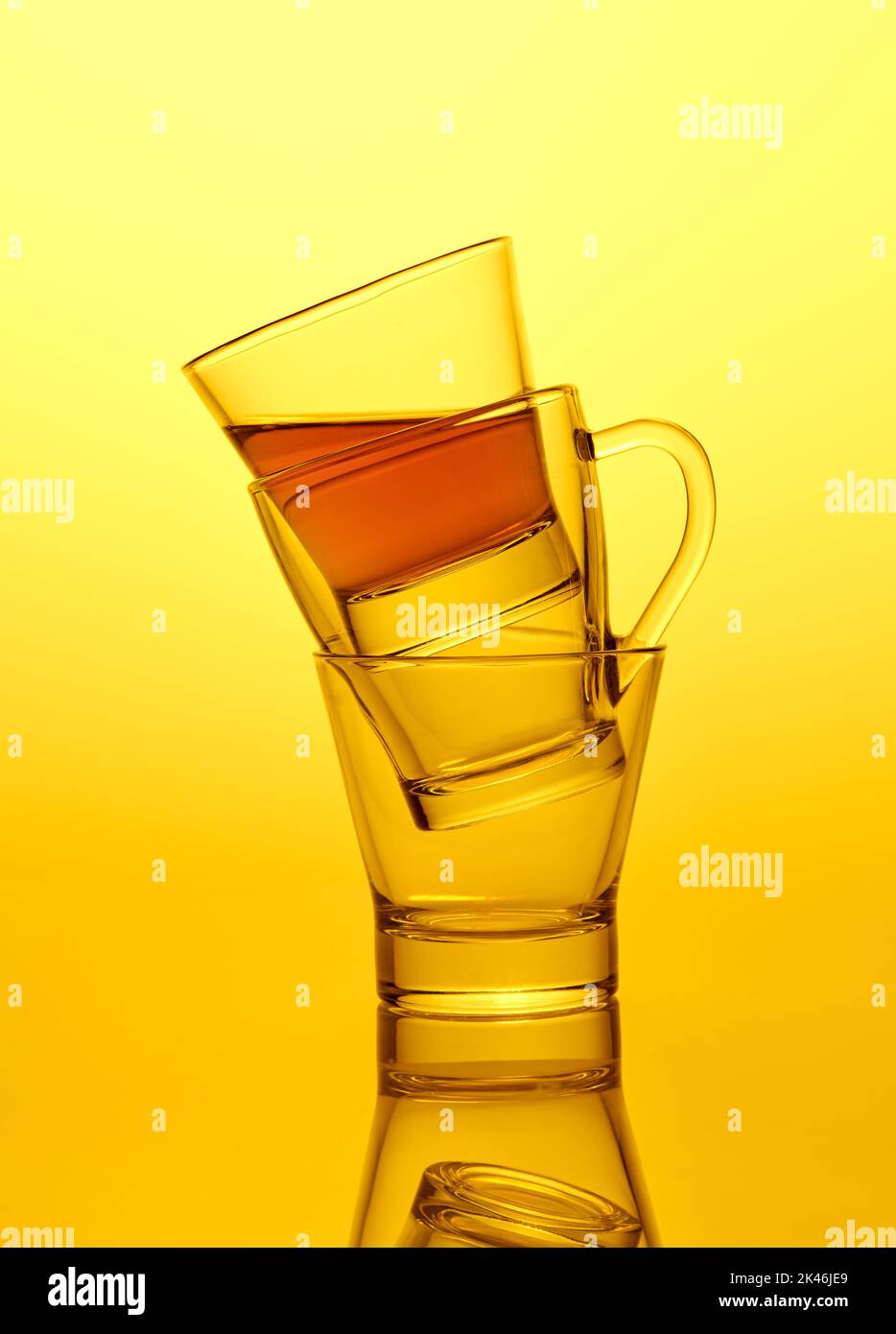 Empty and half full double glass tea cups standing like a pyramid Stock ...