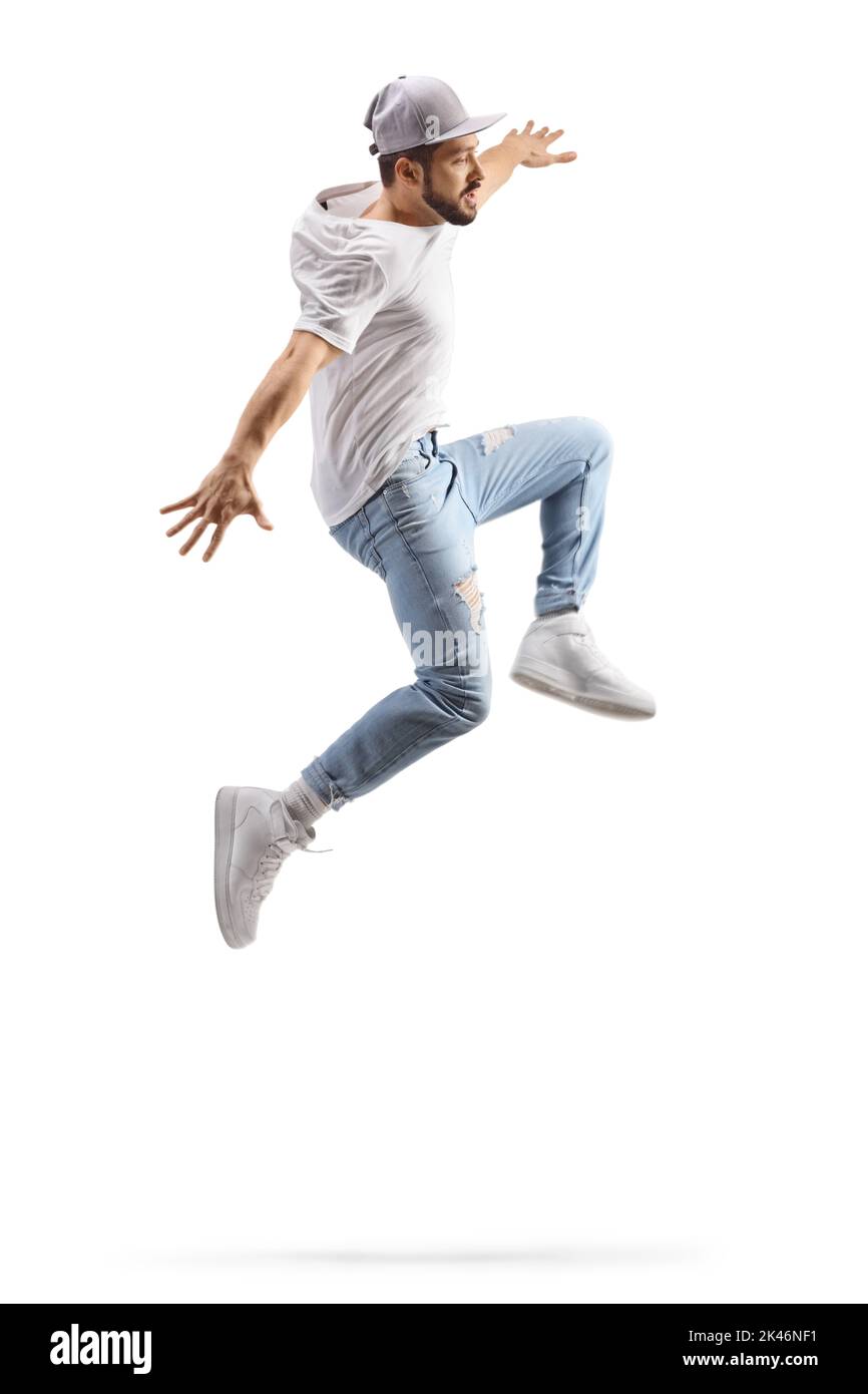 Young man performing a dance jump isolated on white background Stock ...