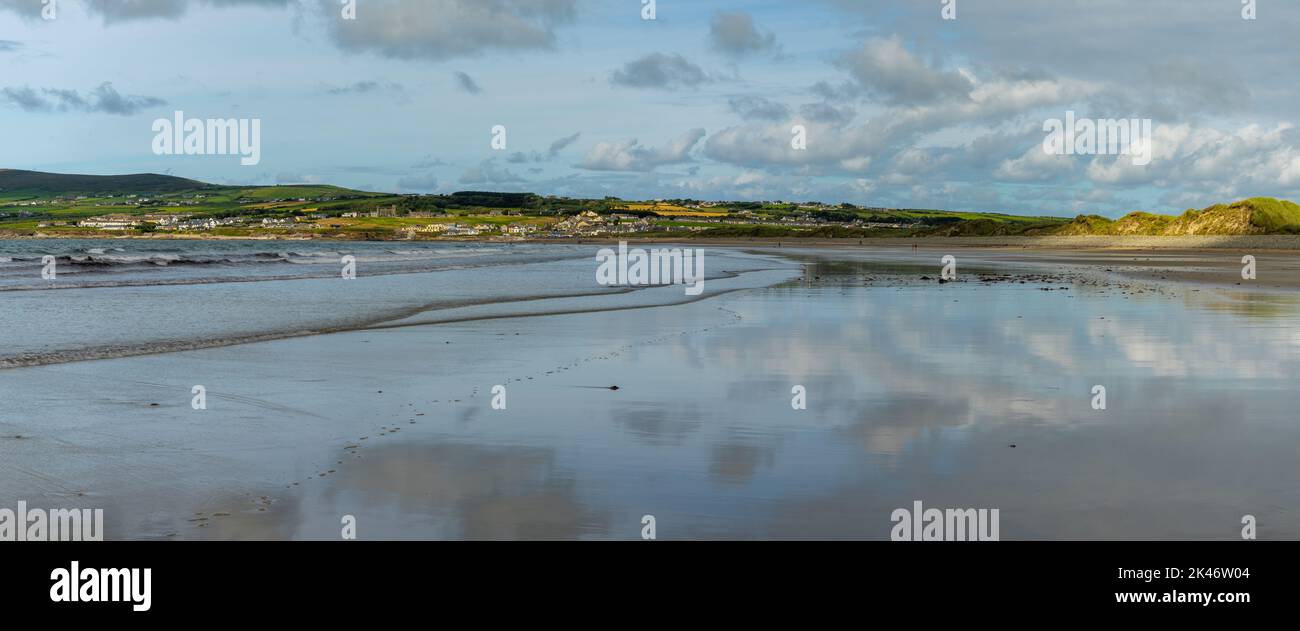 panorama landscape view of Ballyheigue beach with reflections of sky ...