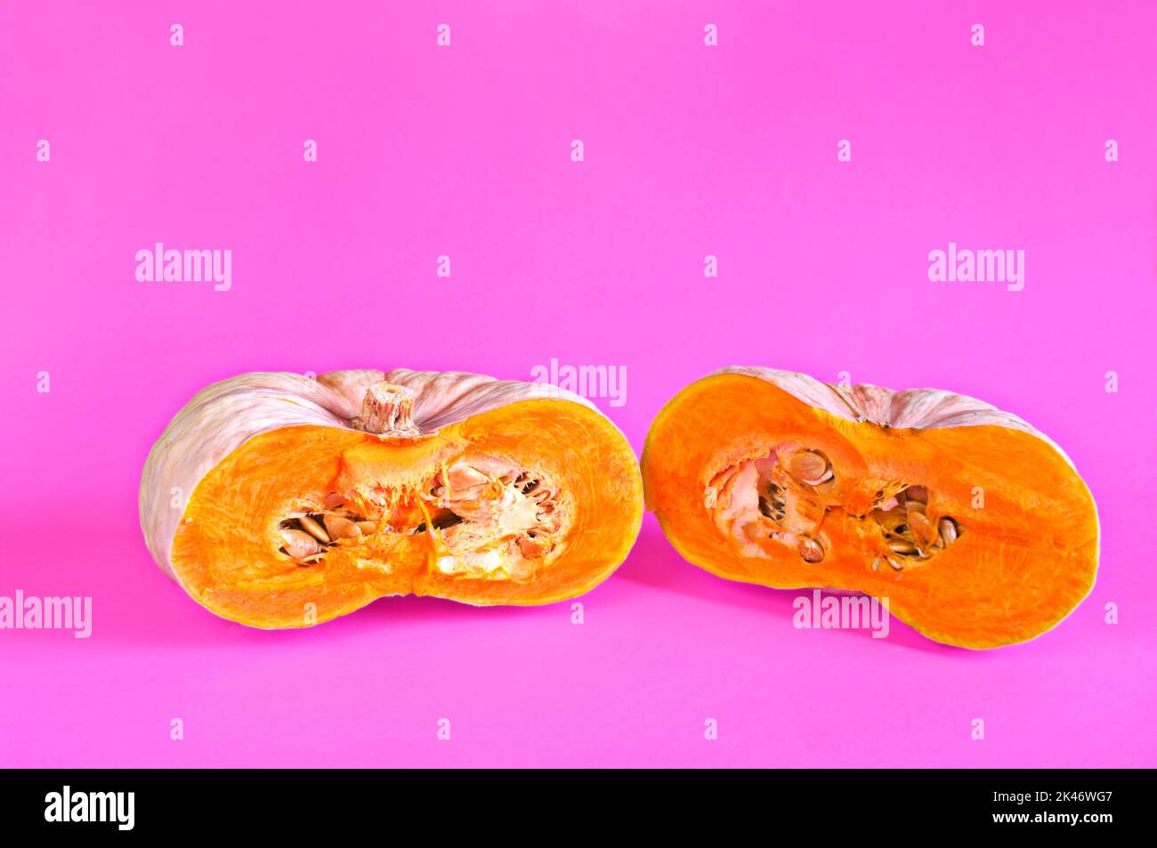 Organic pumpkin cut in half. Food for the fall. Halloween Stock Photo ...