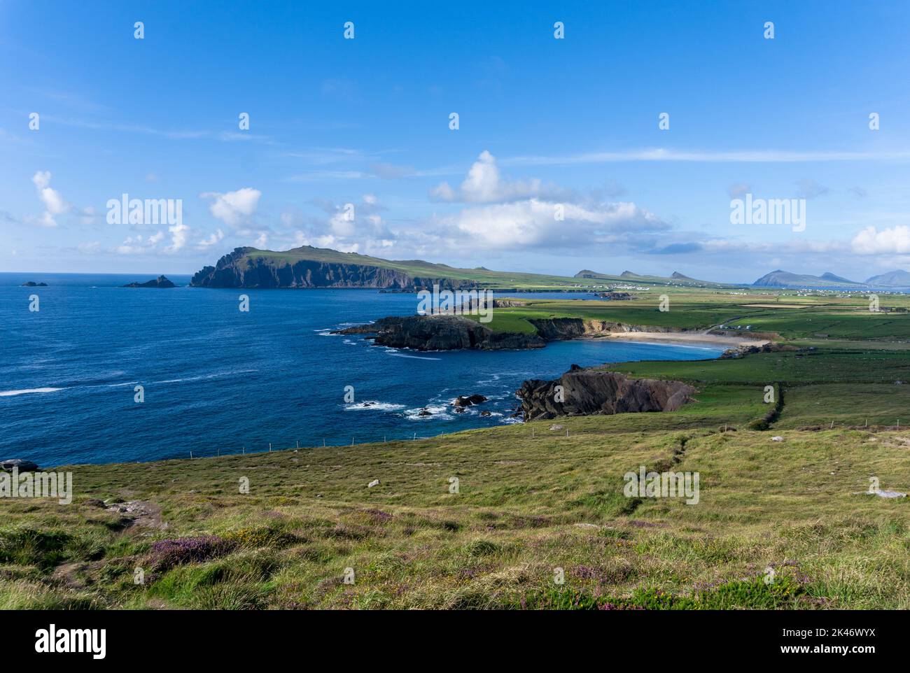 picturesque coastal landscape with green meadows and rugged cliffs on a ...
