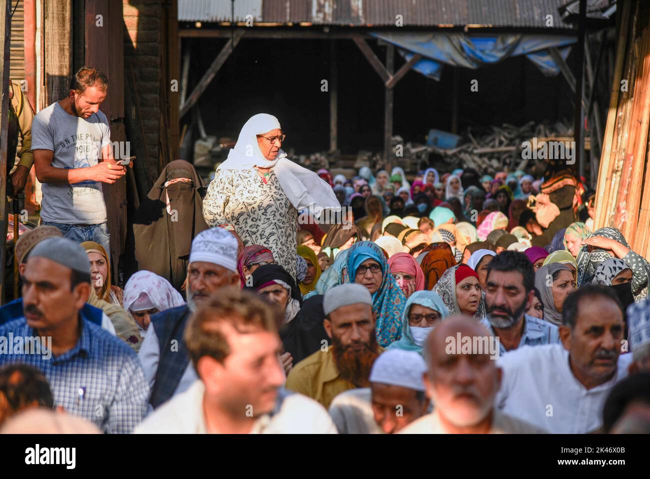 Srinagar, India. 30th Sep, 2022. Muslim devotees offer prayers along ...