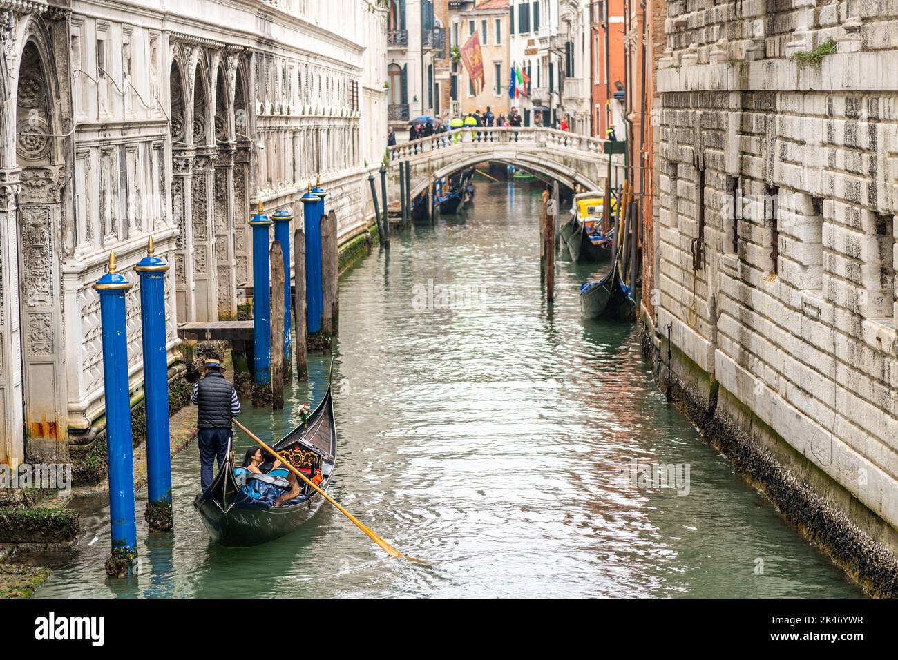 A gondola going down a canal in Venice, Italy Stock Photo - Alamy