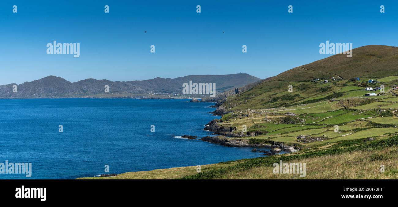 A panorama view of the Iveragh Peninsula and Kells Bay in County Kerry ...