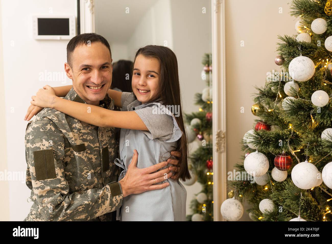 Armed Forces Soldier Hugging his daughter In Front Christmas Tree Stock ...