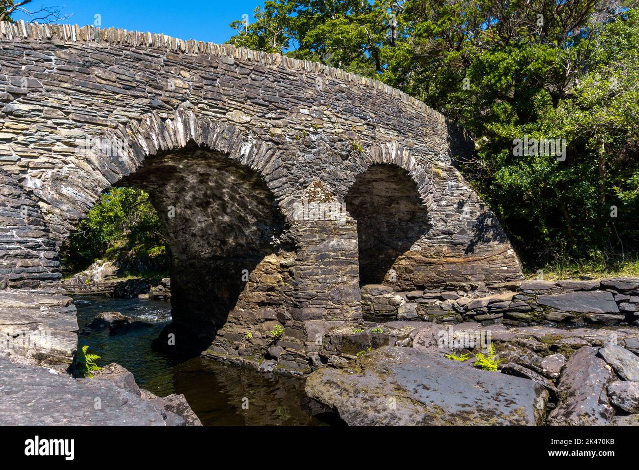 A view of the historic Old Weir Bridge at The Meeting of The Waters in ...