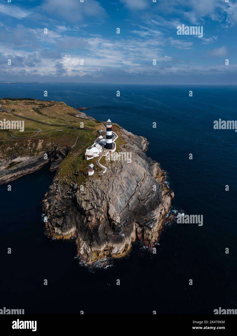 A vertical view of the lighthouse and the Old Head of Kinsale in County ...