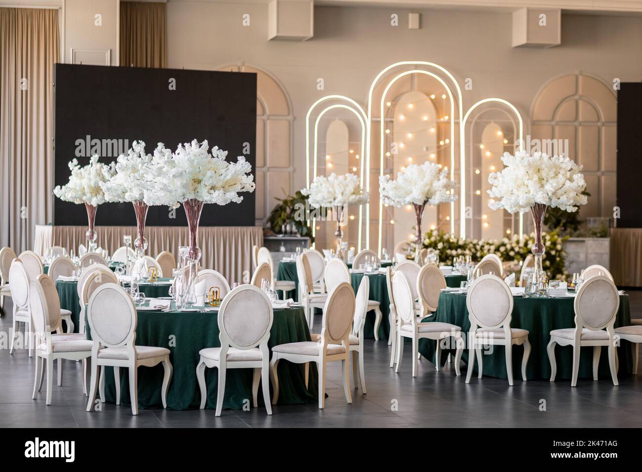Restaurant tables decoration on golden lights with digital screen ...
