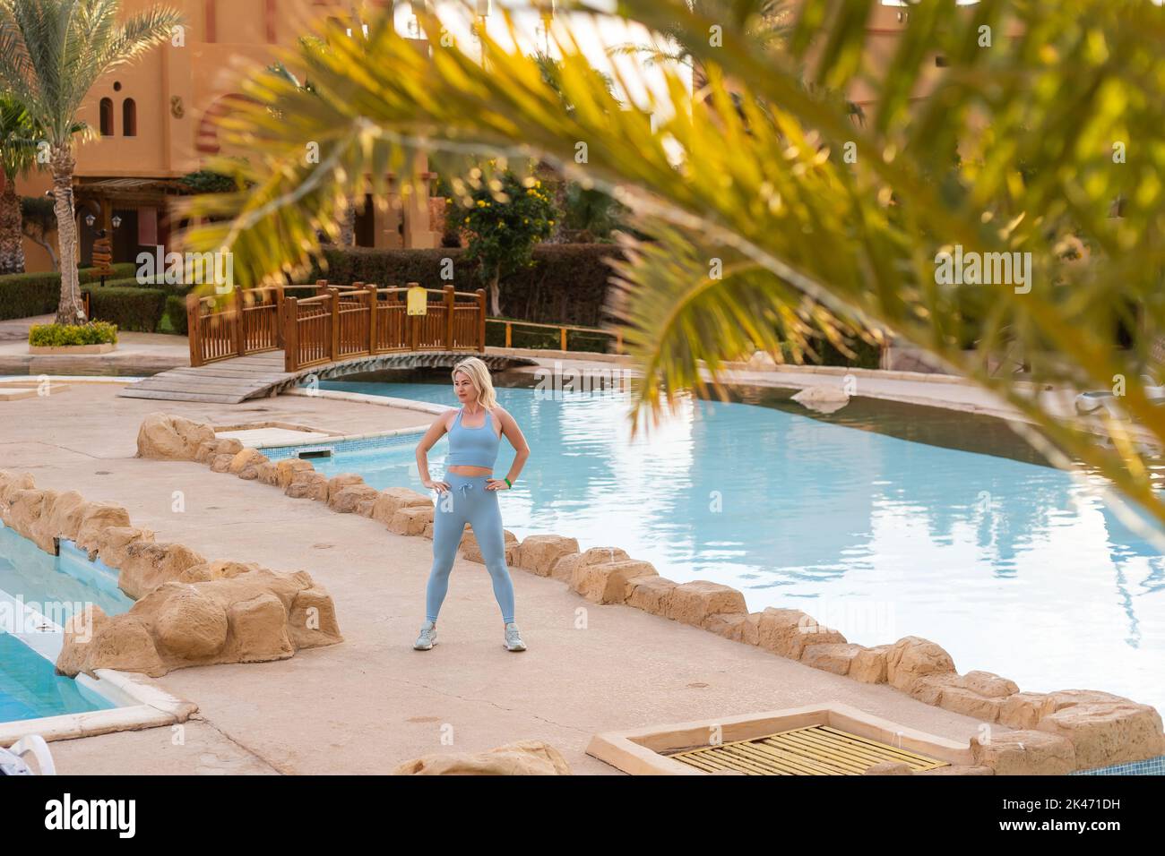 Good morning with yoga meditating on sunrise background. Active woman ...