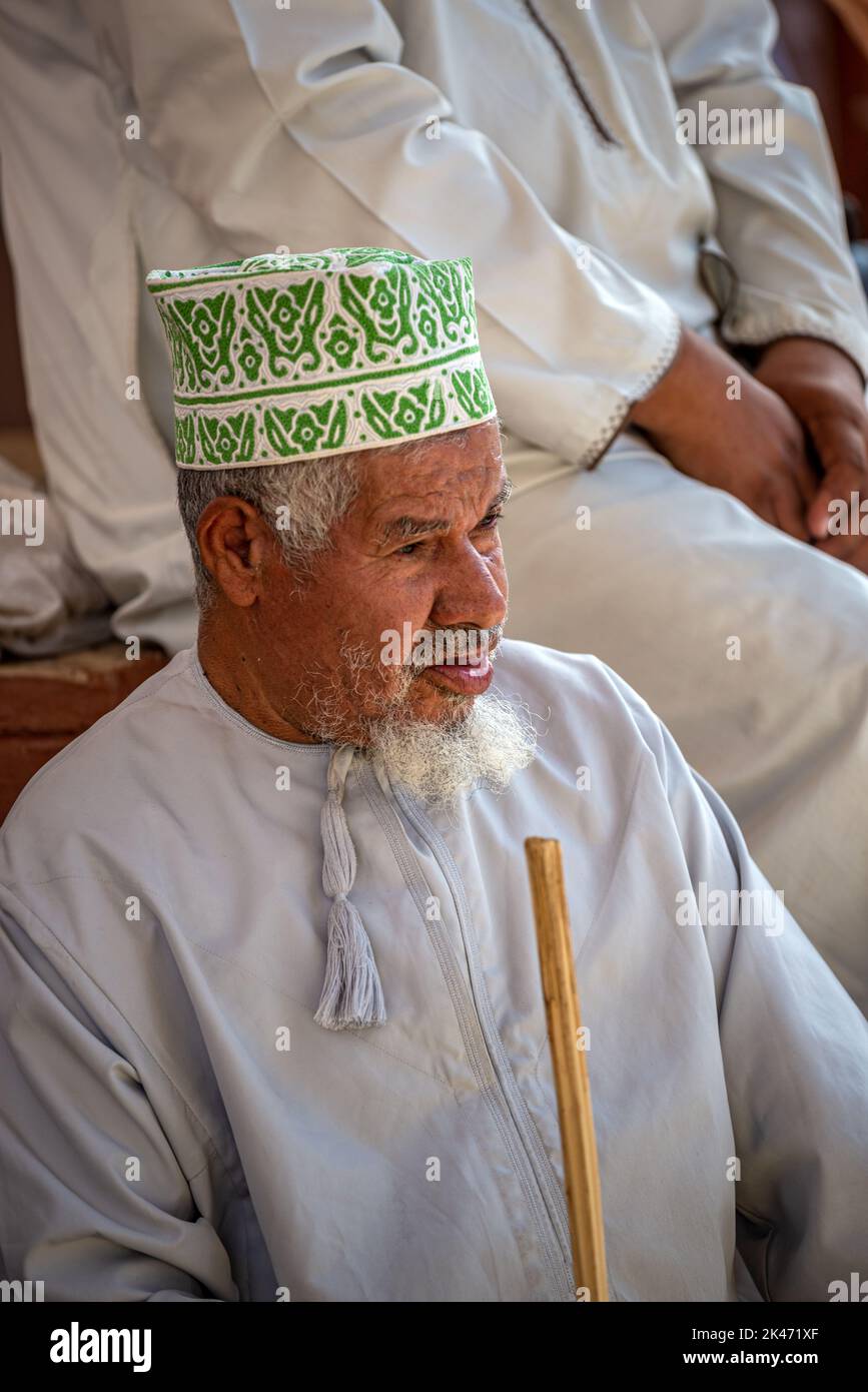 Portrait of a bearded old man with kuma (Omani traditional round hat ...