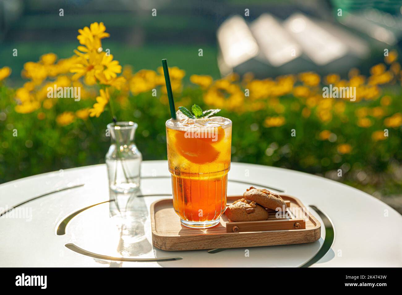 fresh homemade peach ice tea with mint, chocolate chip cookie served on ...