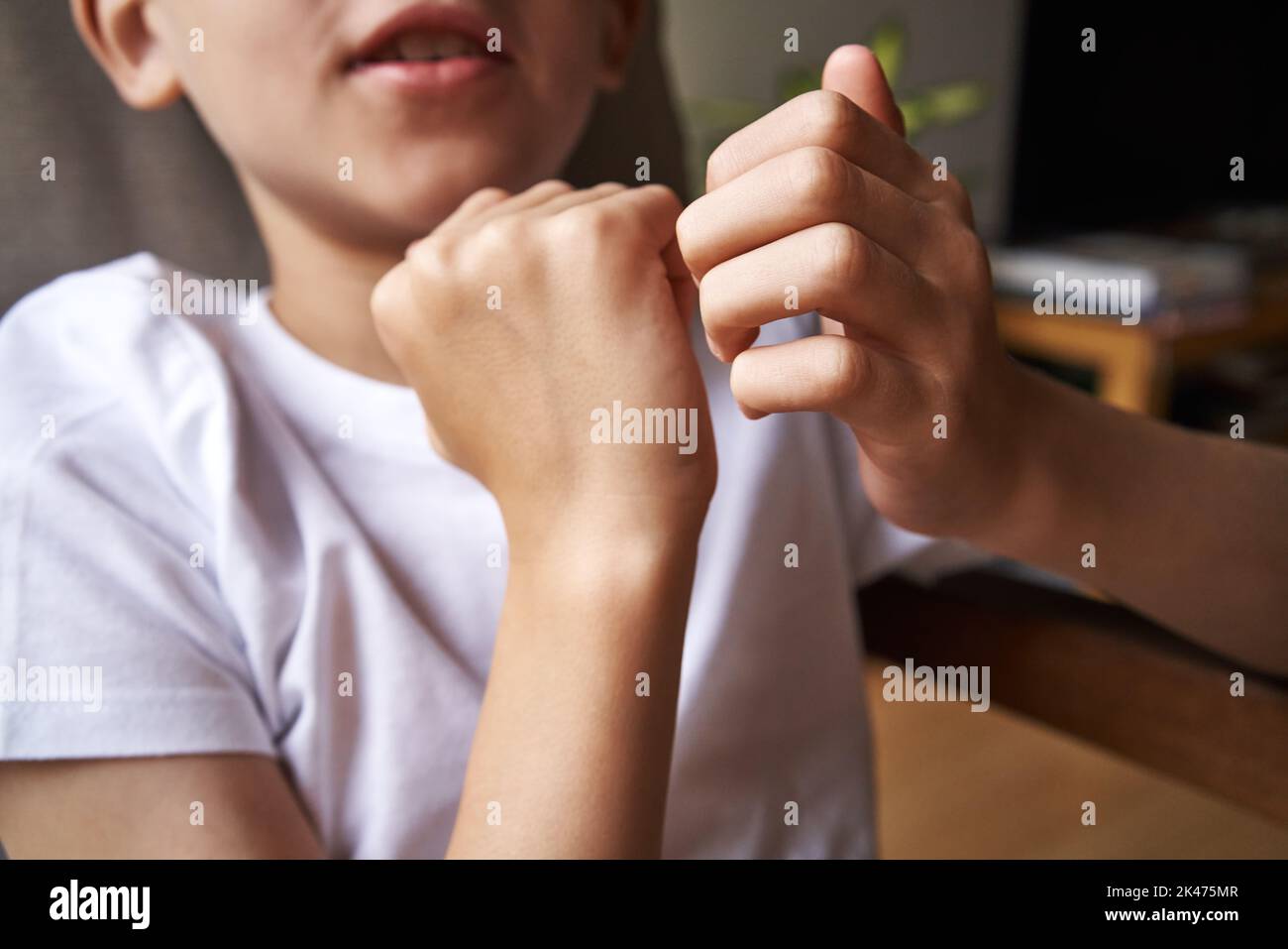 Little boy practicing EFT or emotional freedom technique - tapping on ...