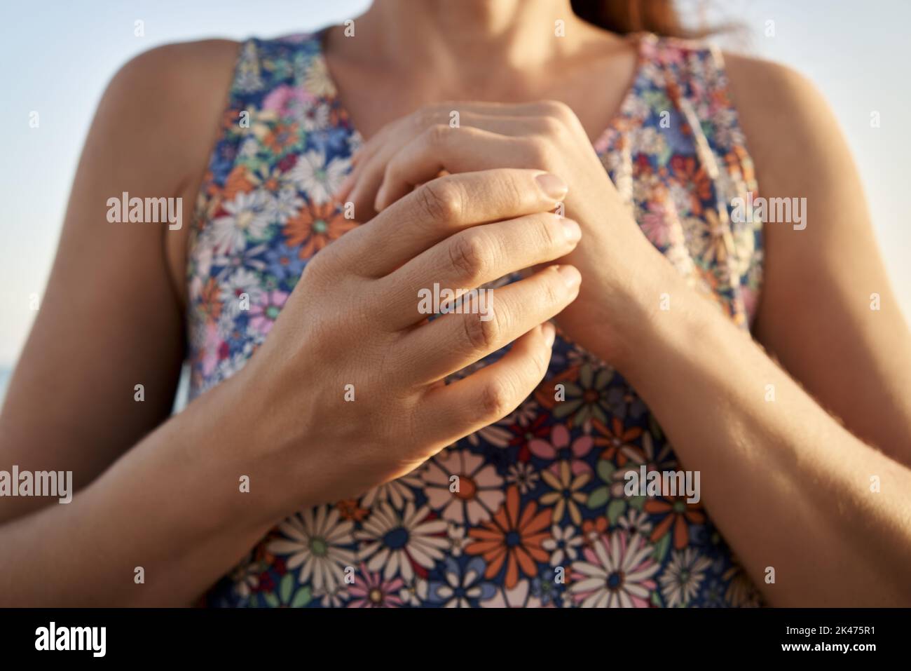 Woman practicing EFT or emotional freedom technique - tapping on the ...