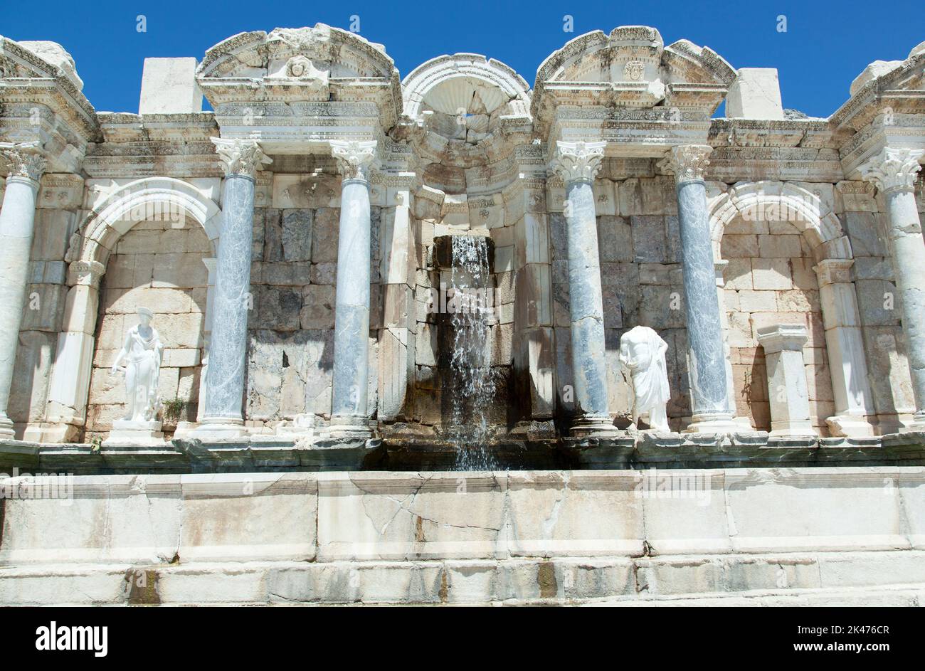 The facade of a fountain in Sagalassos ancient Greek city with natural ...