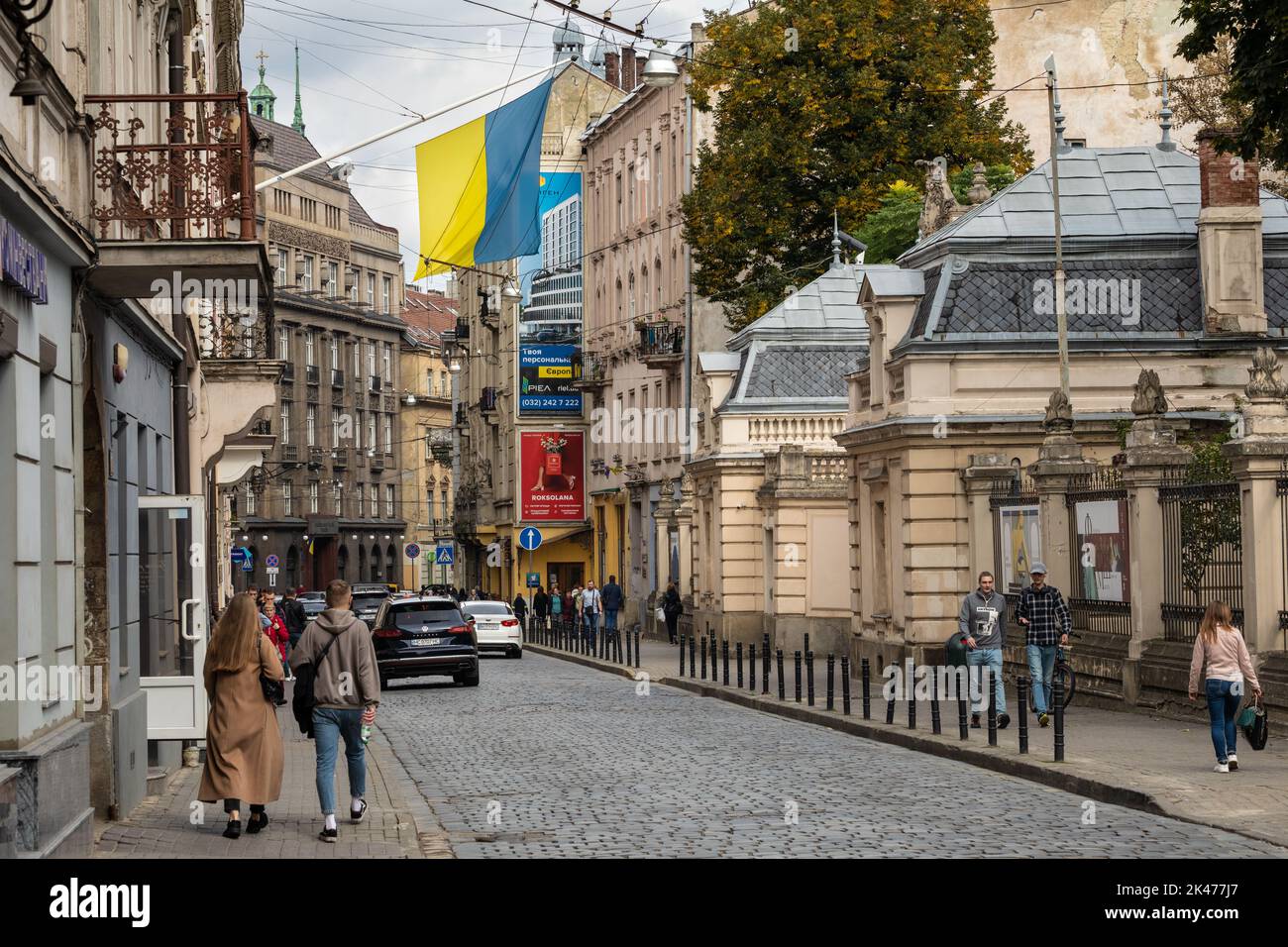 Ukraine flag floats above a street in historic downtown Lviv during ...