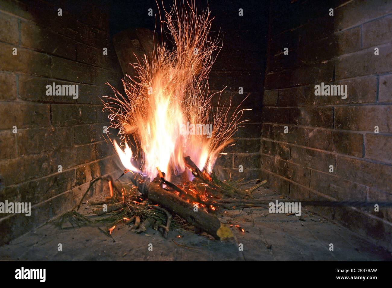Sparkling fire inside a fireplace Stock Photo - Alamy