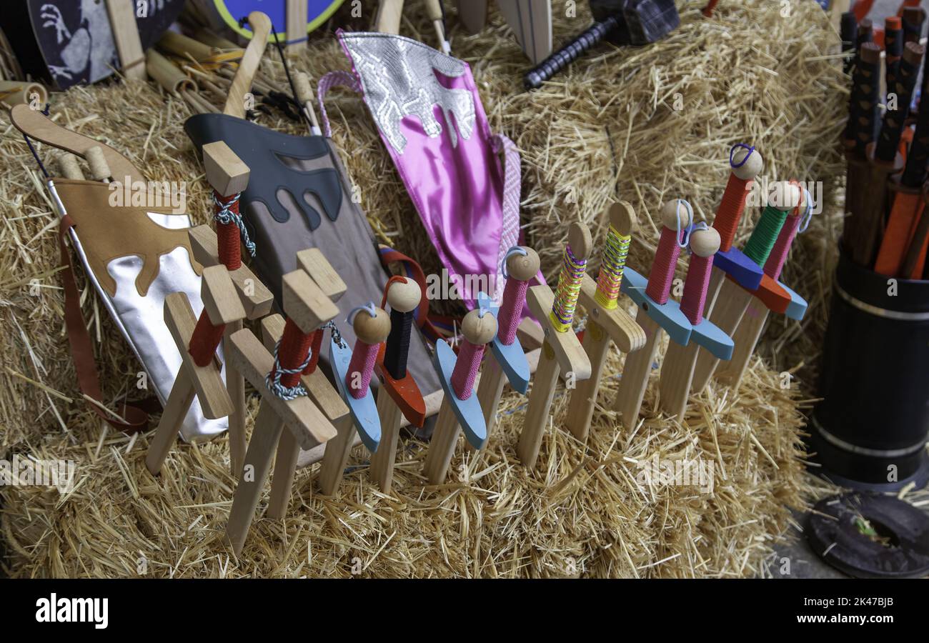 Detail of children's wooden toys, medieval swords Stock Photo - Alamy