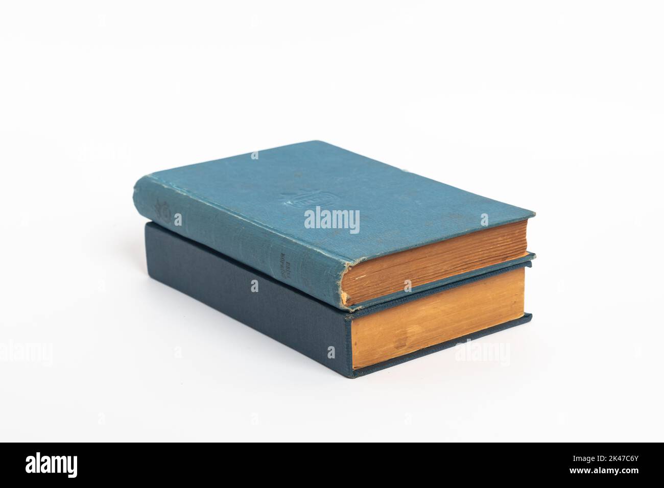 Old blue book isolated on a white background , Old vintage book with a ...
