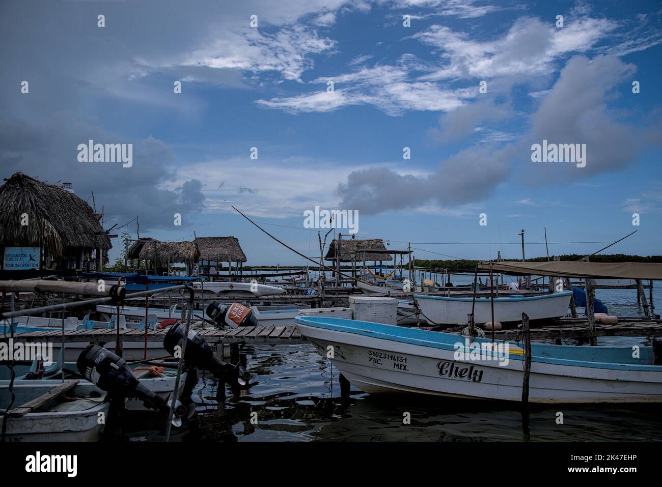 Coastal view of fishing and tourism sight seeing boats docked in Mexico ...