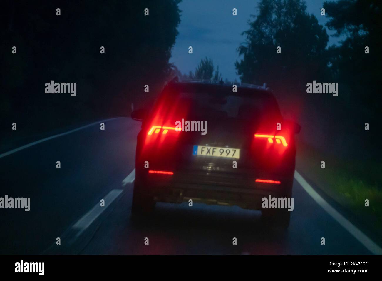 Car driving in fog at night Stock Photo - Alamy