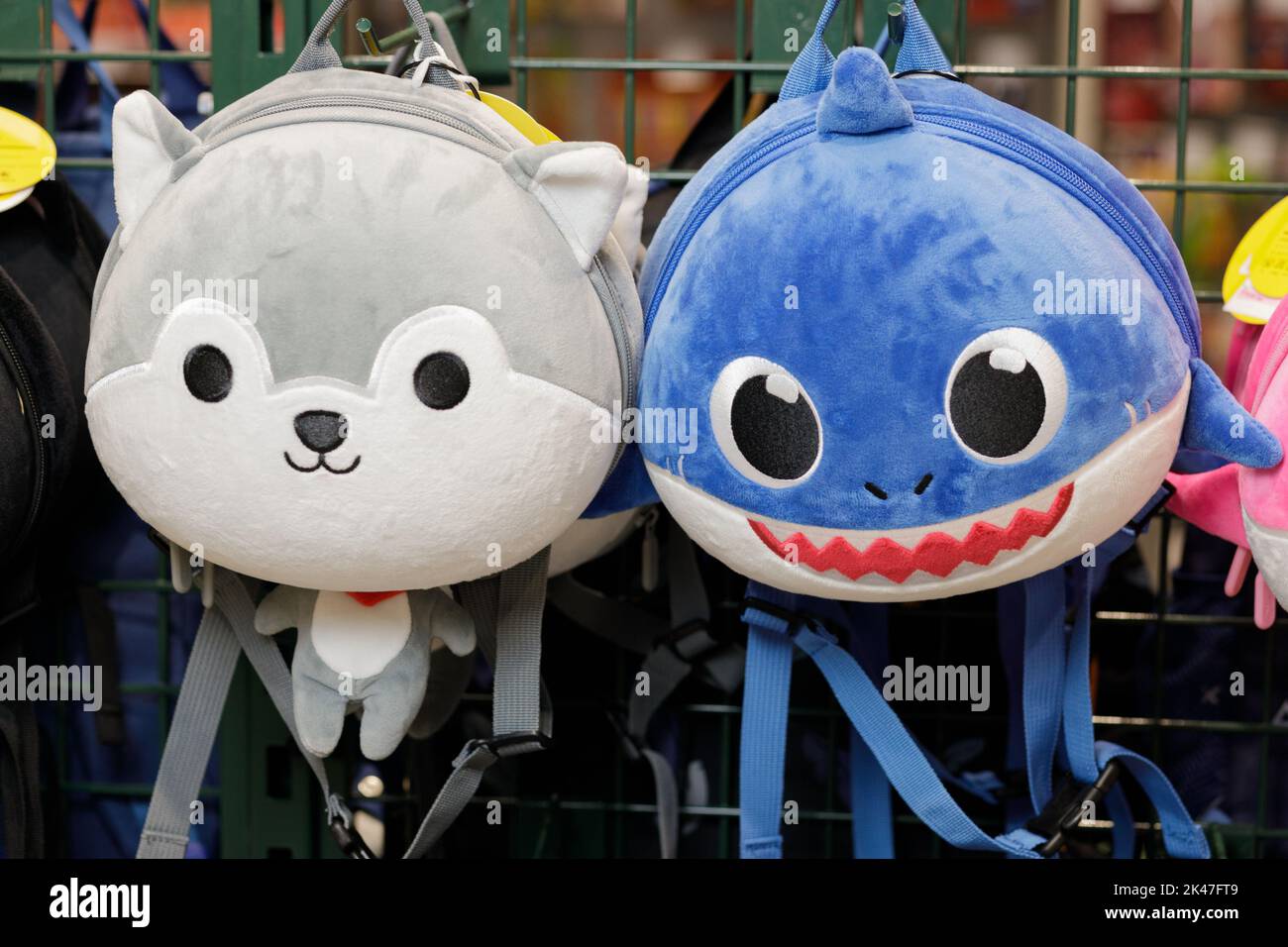 Children's backpack in the shape of wolf and shark animals Stock Photo ...