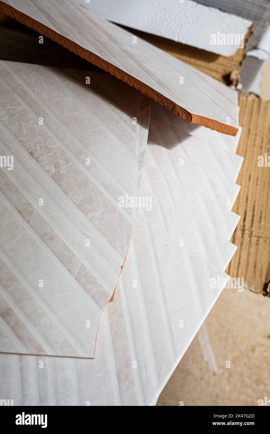 Pile of ceramic tiles in the bathroom, indoor walls. Conceptual repair ...