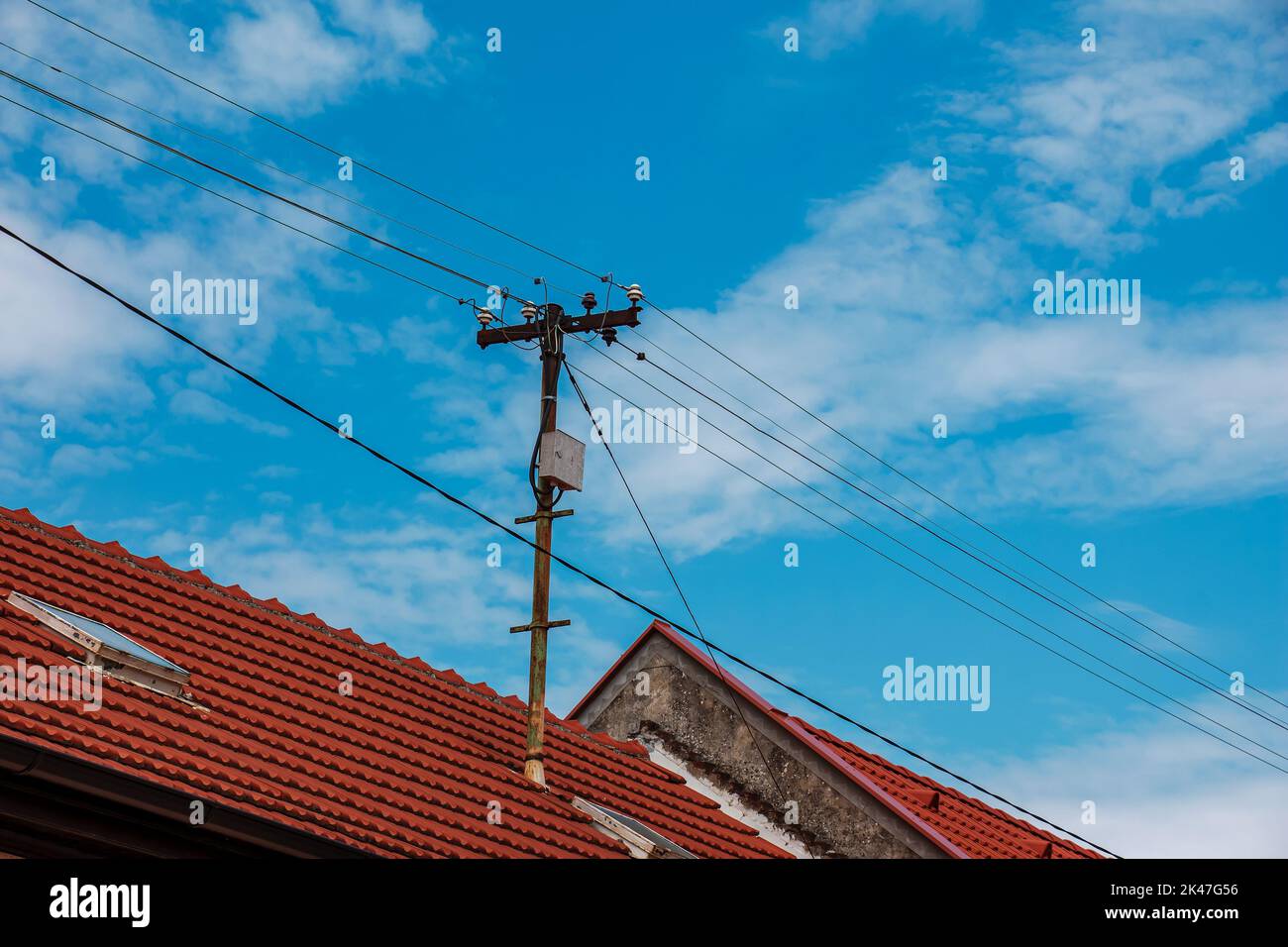 Power lines on the roof of the house Stock Photo - Alamy