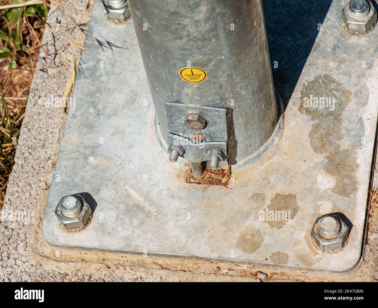 Power pole support. Fastening the base of the support with bolts Stock ...