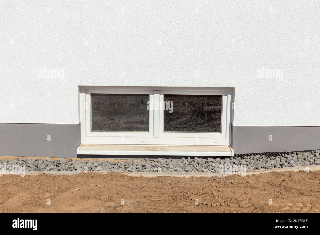 cellar window at a new built family house with white window sill Stock ...