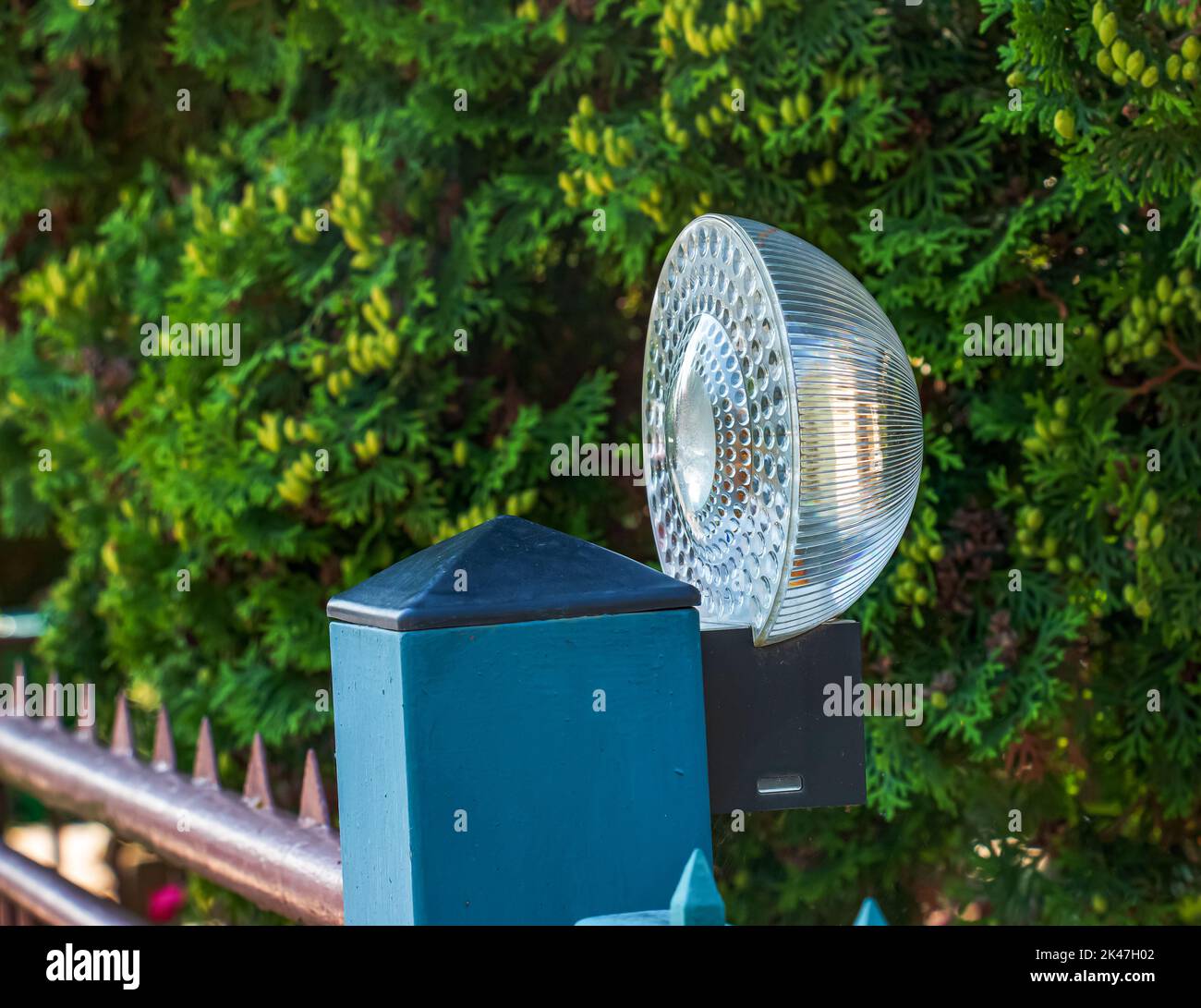 Lighting spotlight on the fence post. Outdoor lighting system Stock ...