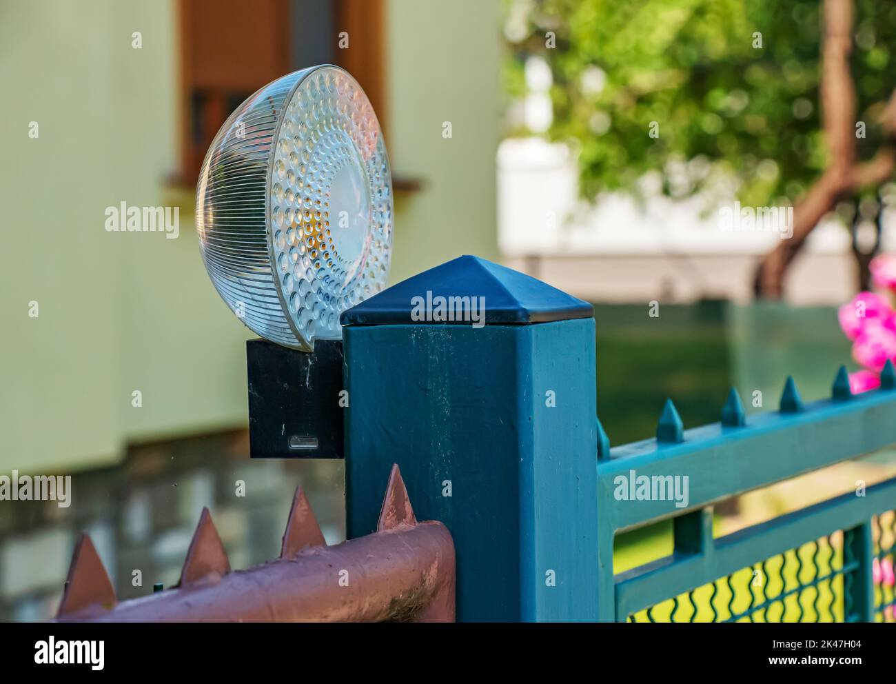 Lighting spotlight on the fence post. Outdoor lighting system Stock ...
