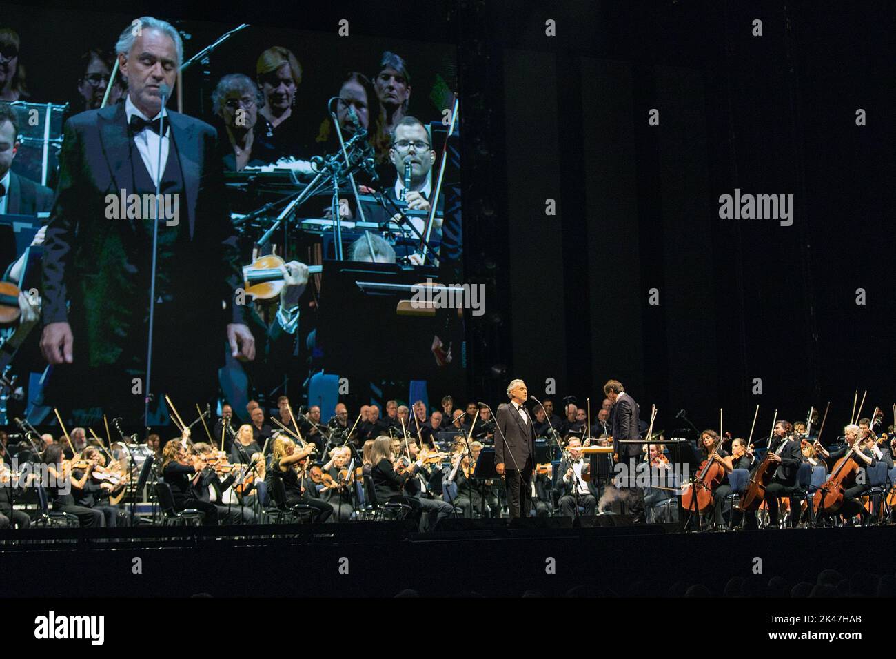 Italian tenor Andrea Bocelli performs (centre) at the O2 Arena ...